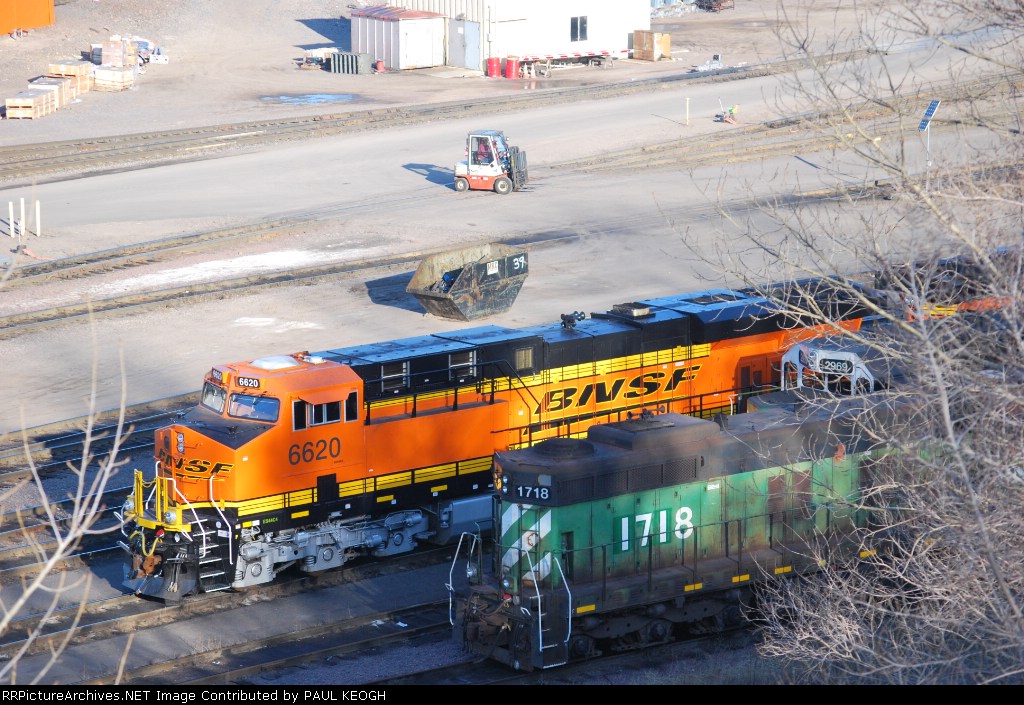BNSF 6620 and BNSF 6619 bask in the early am rays waiting for next train.